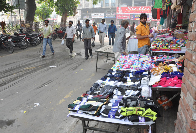 Encroachments galore as footpaths come in handy for shopkeepers - The ...