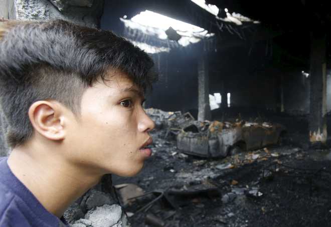 Toll rises to 72 in Philippine factory fire - The Tribune