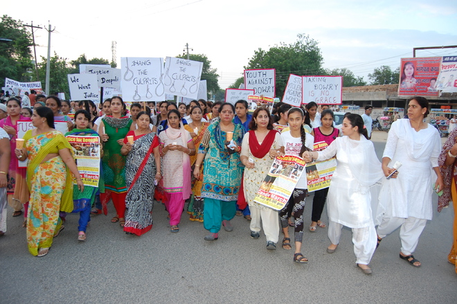 Candle march taken out for justice to dowry victim - The Tribune