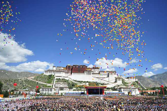 China showcases 50 years of its hold on Tibet with big parade - The Tribune