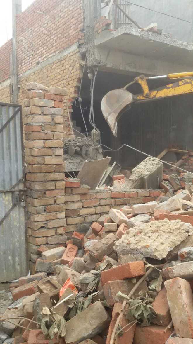 Parts of buildings demolished - The Tribune