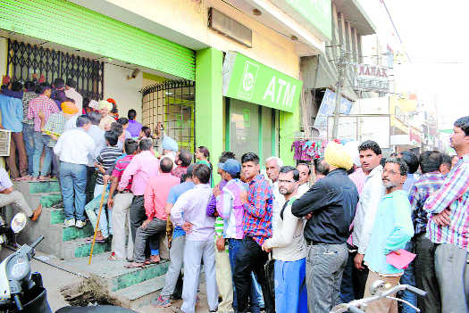 People line up outside ATMs : The Tribune India