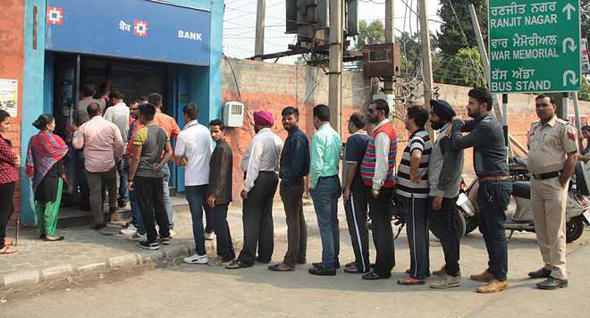 Long queues continue outside banks, ATMs - The Tribune