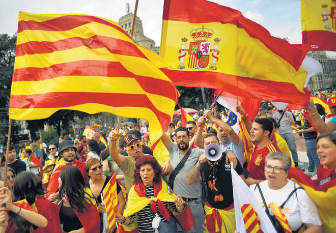 Spain marks national day with show of unity in crisis - The Tribune