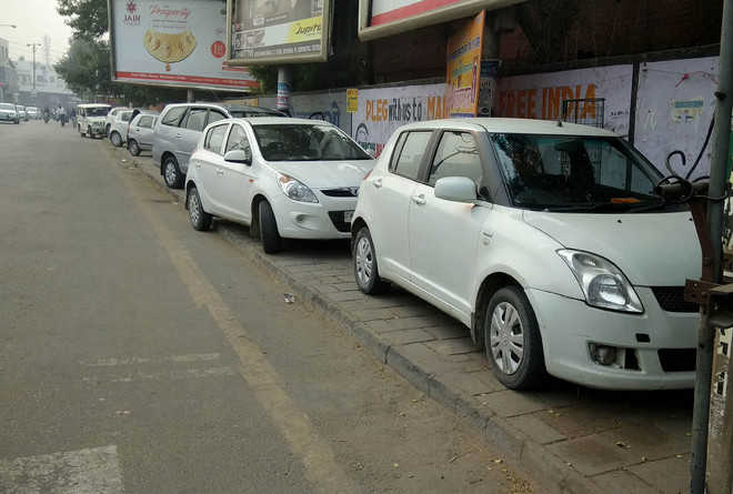 Left with no option, residents park vehicles on footpath : The Tribune ...