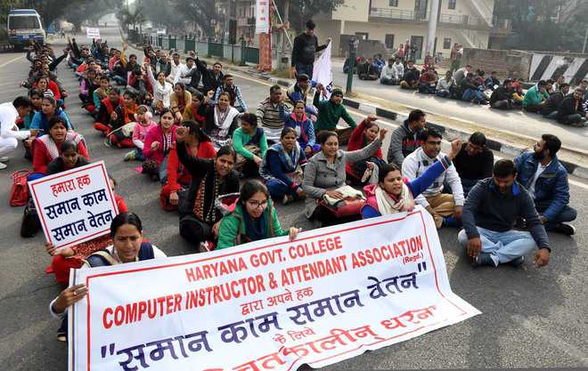 Computer instructors protest, seek pay parity - The Tribune