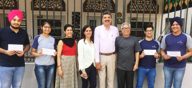 School felicitates merit holders - The Tribune