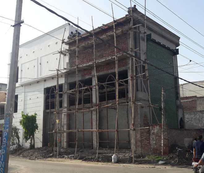 Were being constructed without approved plans, in violation of building ...