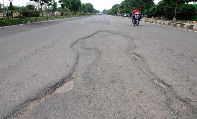 Airport road almost non-motorable - The Tribune