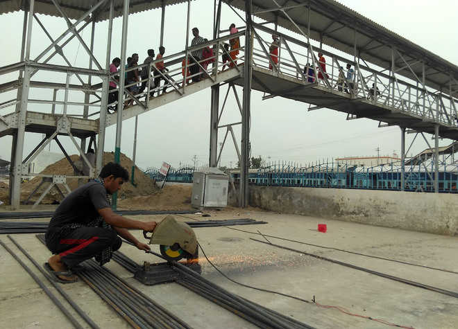 Work on foot overbridge at city railway station begins - The Tribune
