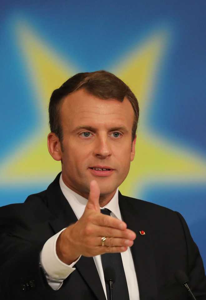 France’s Macron unveils tricky first budget - The Tribune