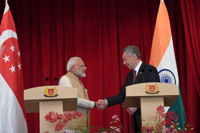 India, Singapore agree to boost trade, sign 8 pacts - The Tribune