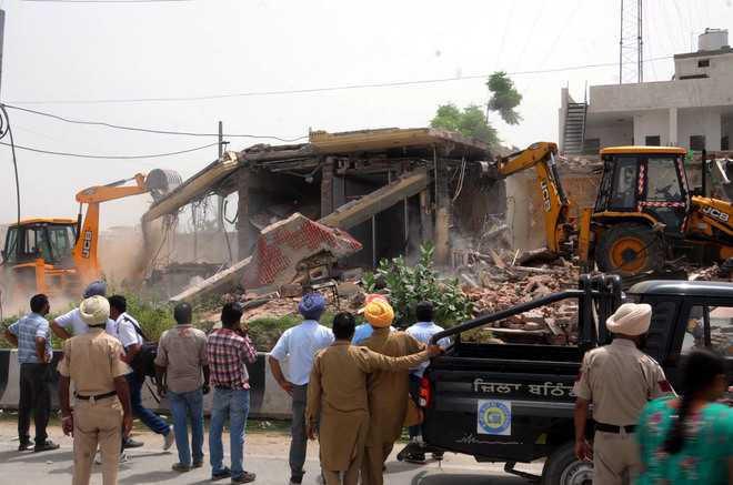 PWD razes buildings along NH-54 - The Tribune