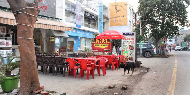 Encroachments in parking areas trouble pedestrians in Model Town market ...
