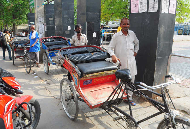 Earnings declining, rickshaw-pullers fight survival battle - The Tribune