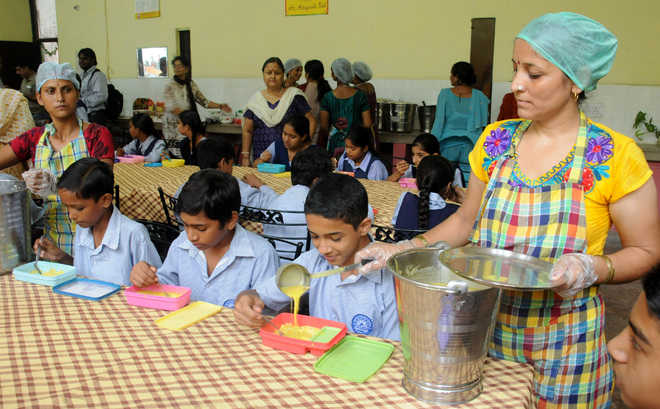 Sans halls, students served mid-day meal in classrooms : The Tribune India