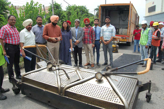 Firm demonstrates road repair technique : The Tribune India